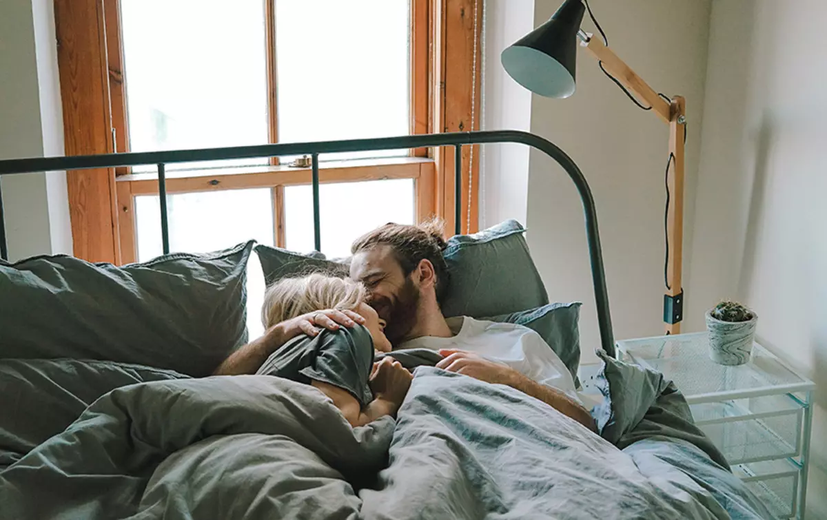 Girl with a guy in bed